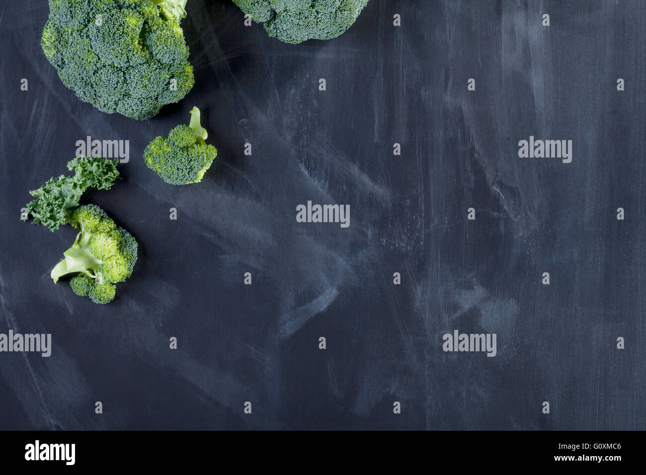 Curly kale and broccoli on blackboard from the top Stock Photo - Alamy