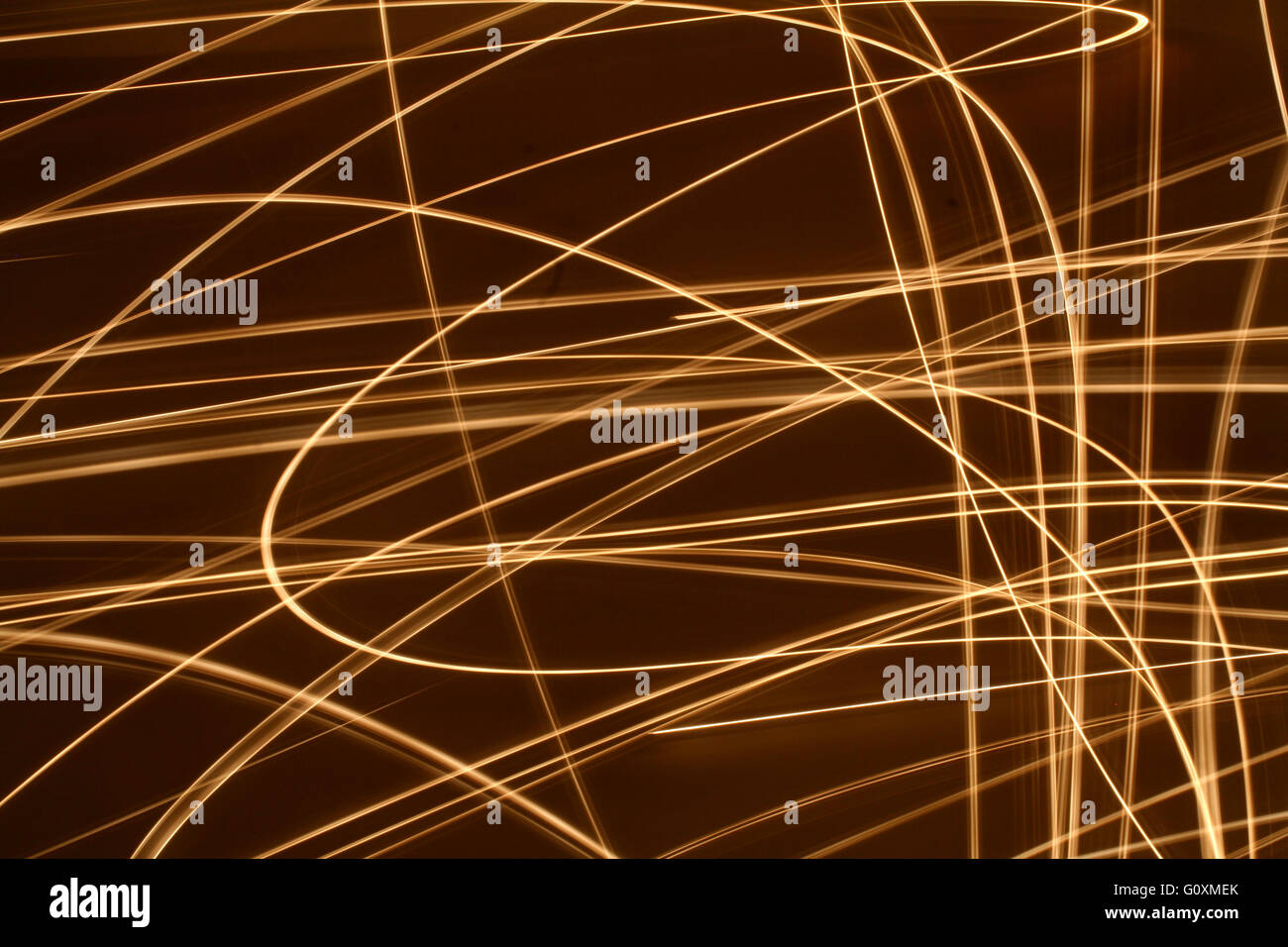 Dancing golden light against a black dark background Stock Photo - Alamy