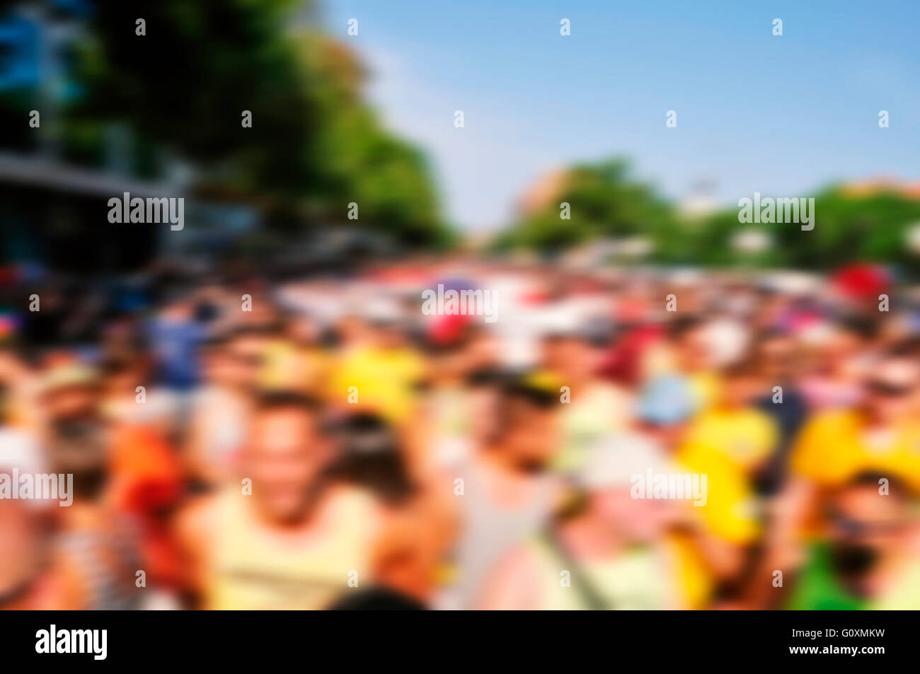 defocused background of a crowd of people partying or marching in a ...