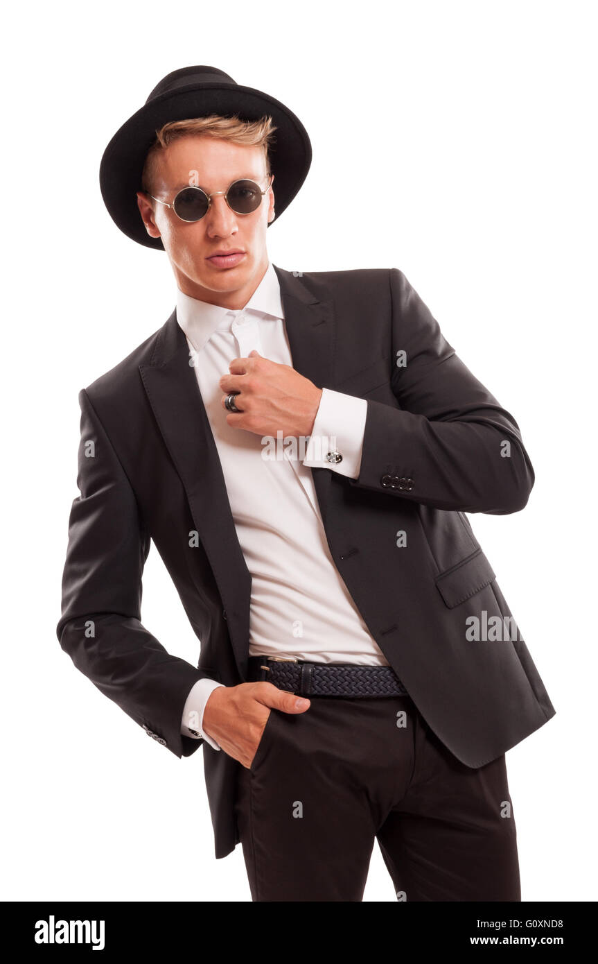 Classy and elegant male model posing wearing designer clothes with a ...