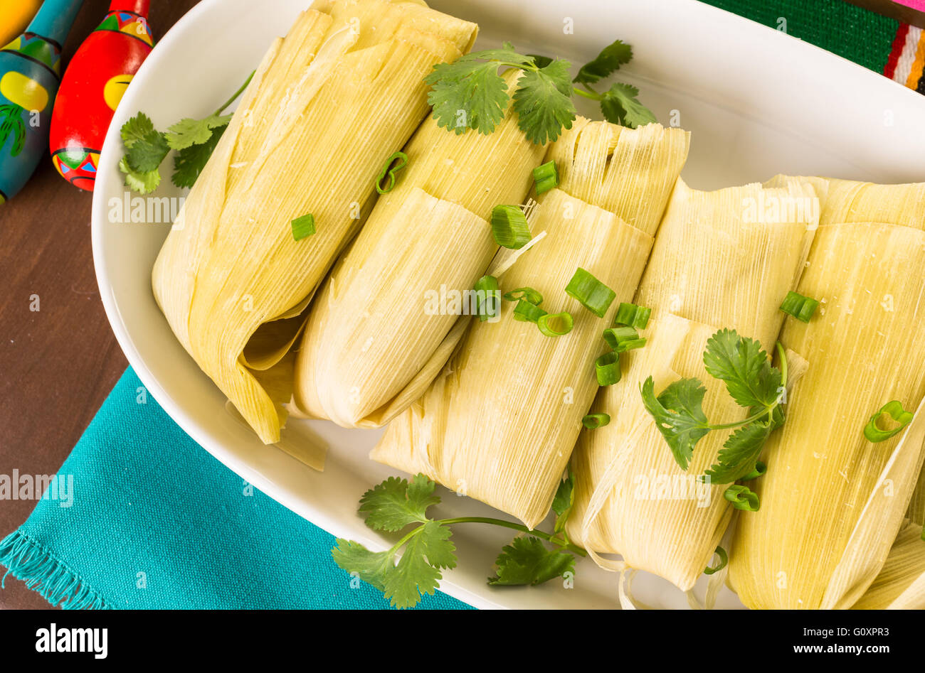 Home made tamales on serving plate on the party table Stock Photo - Alamy