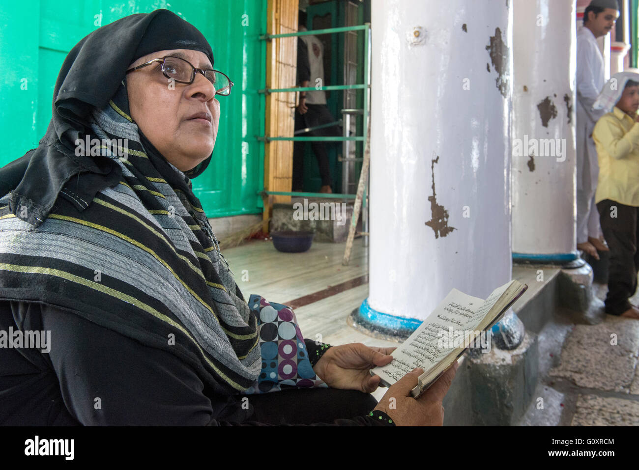 Hussain Tekri, Pious Woman Reading The Holy Quran At The Shrine Stock ...