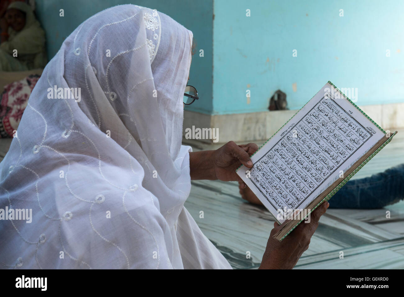 Hussain Tekri, Pious Woman Reading The Holy Quran At The Shrine Stock ...