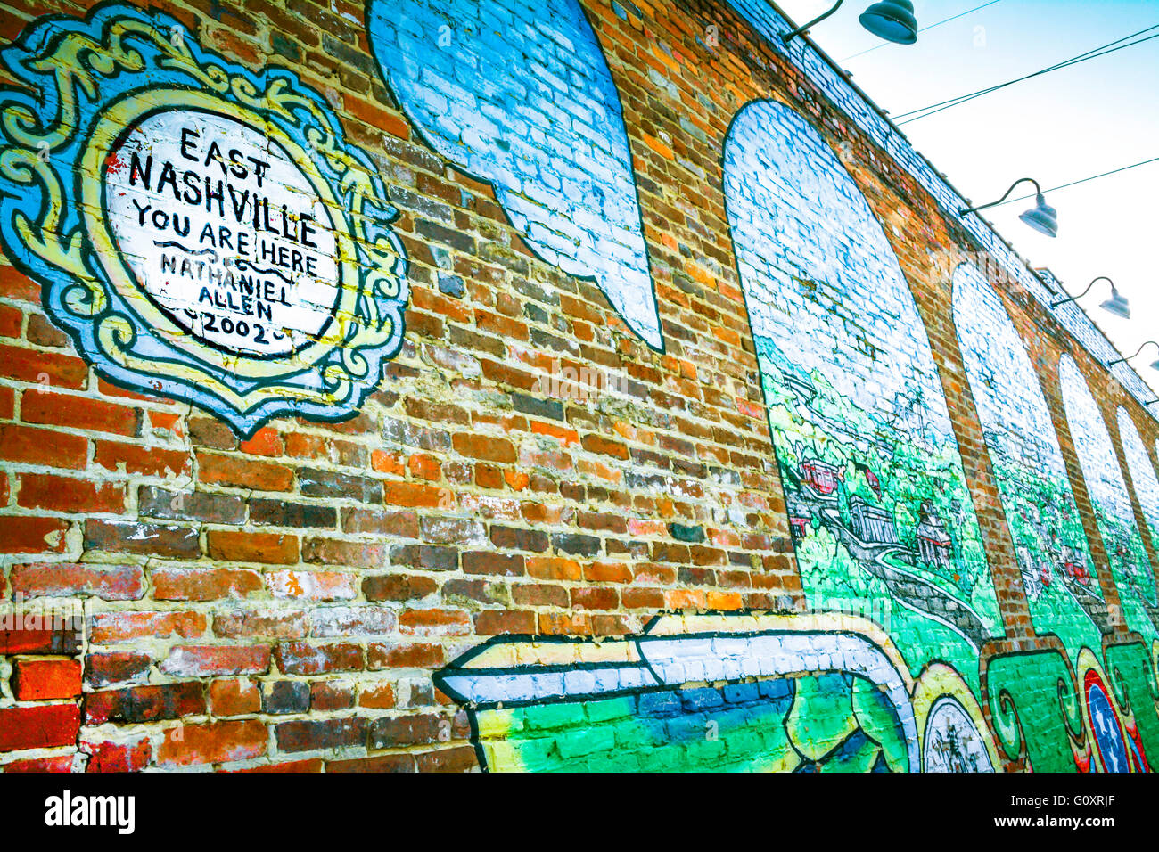 Artistic and colorful mural on Eastside Cycles brick building at trendy ...