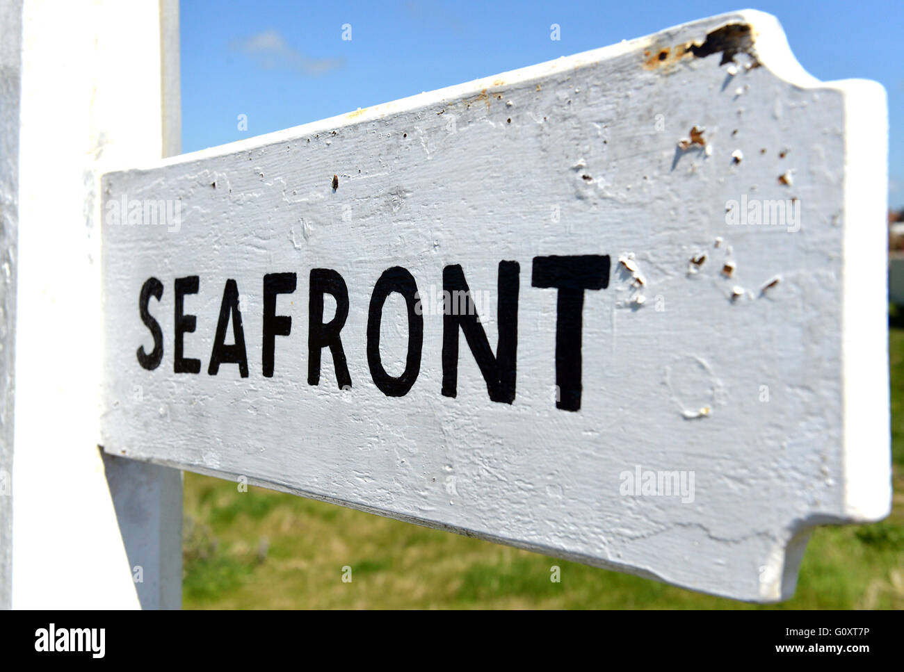 Seafront sign black on white traditional finger post Stock Photo - Alamy