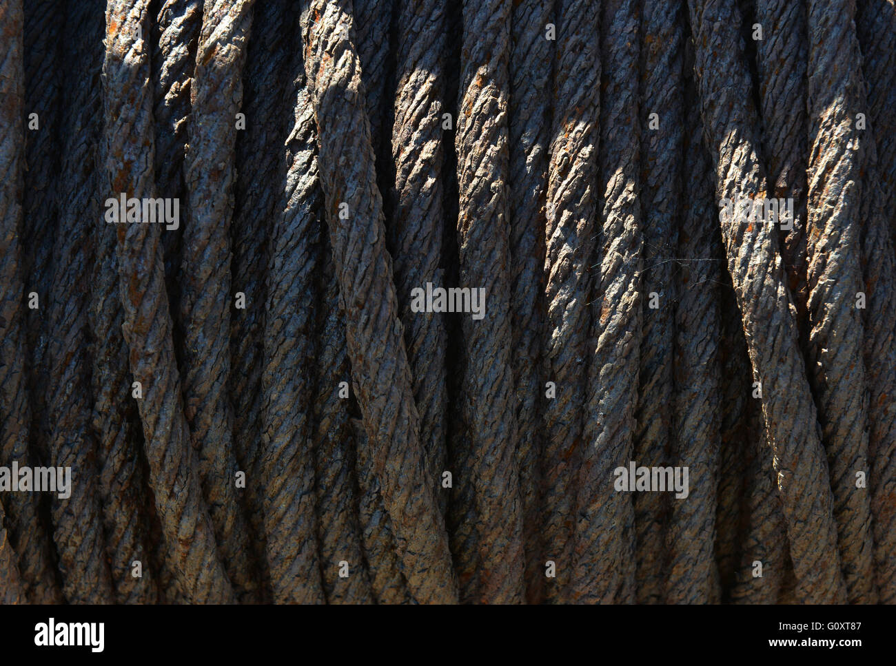 Rusty metal rope on old boat winch Stock Photo - Alamy