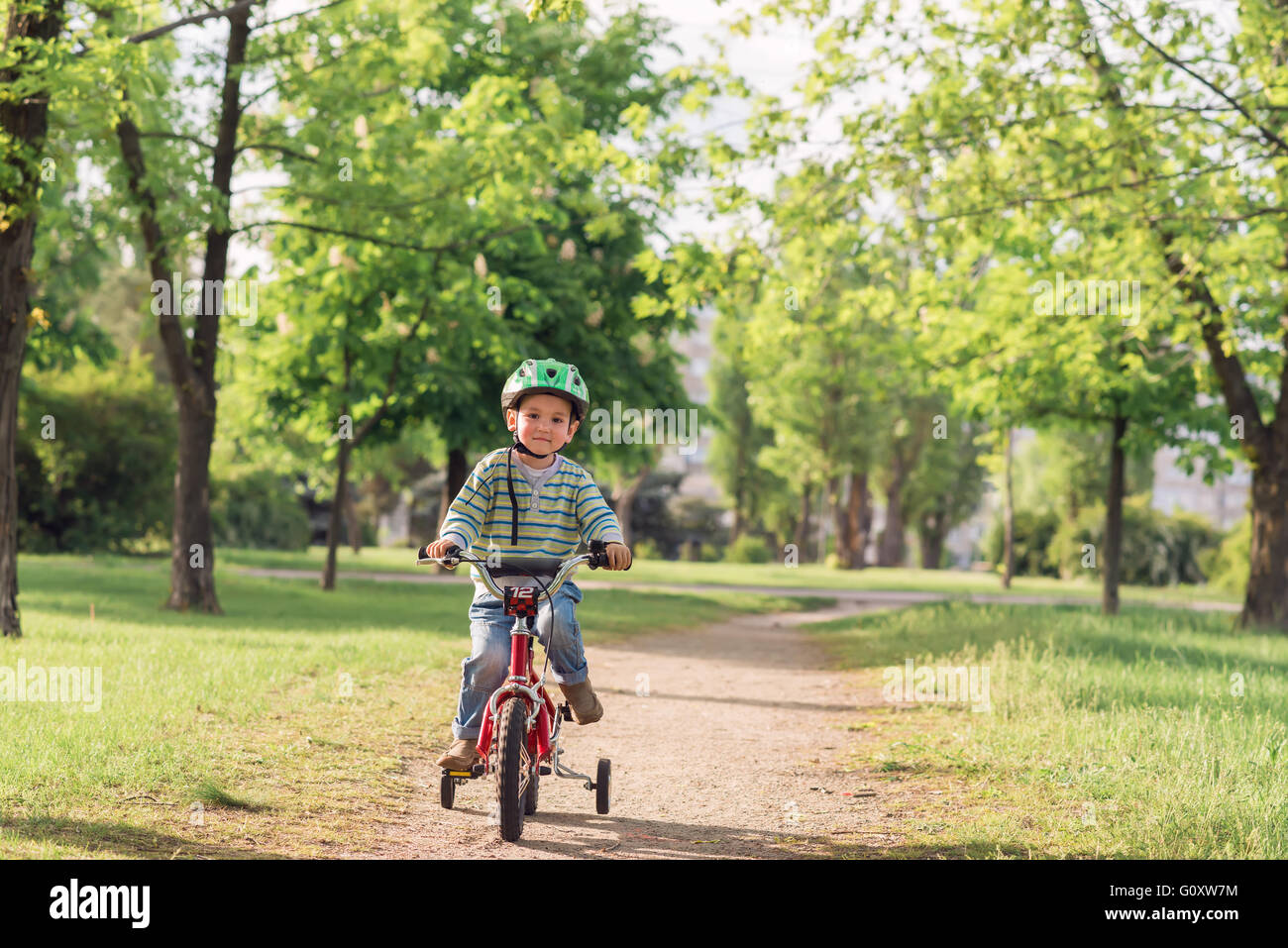 The child riding a bicycle Stock Photo - Alamy