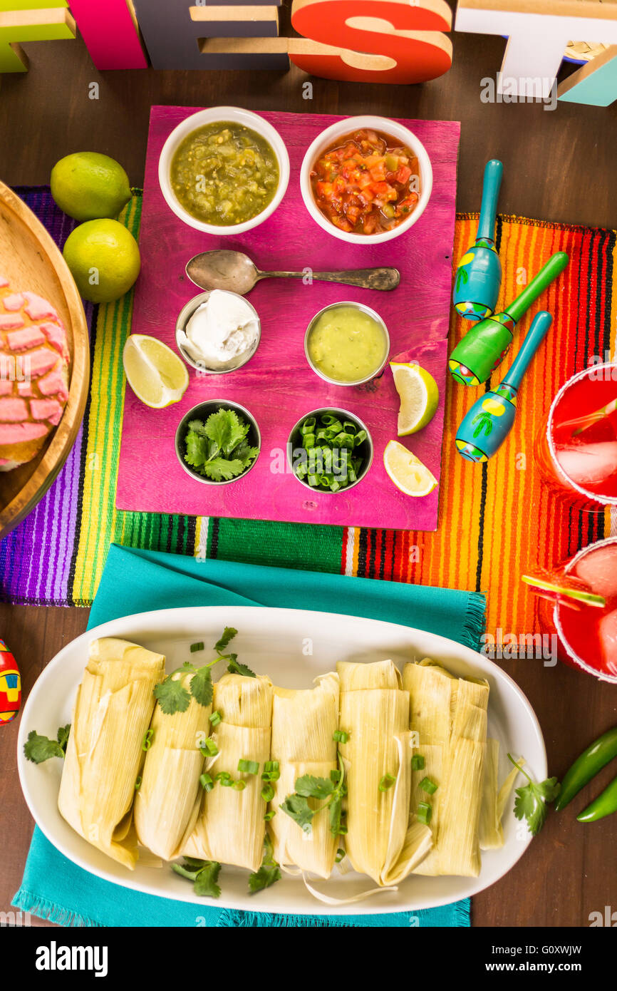 Party table with tamales, strawberry margartisa and pan dulche bread ...