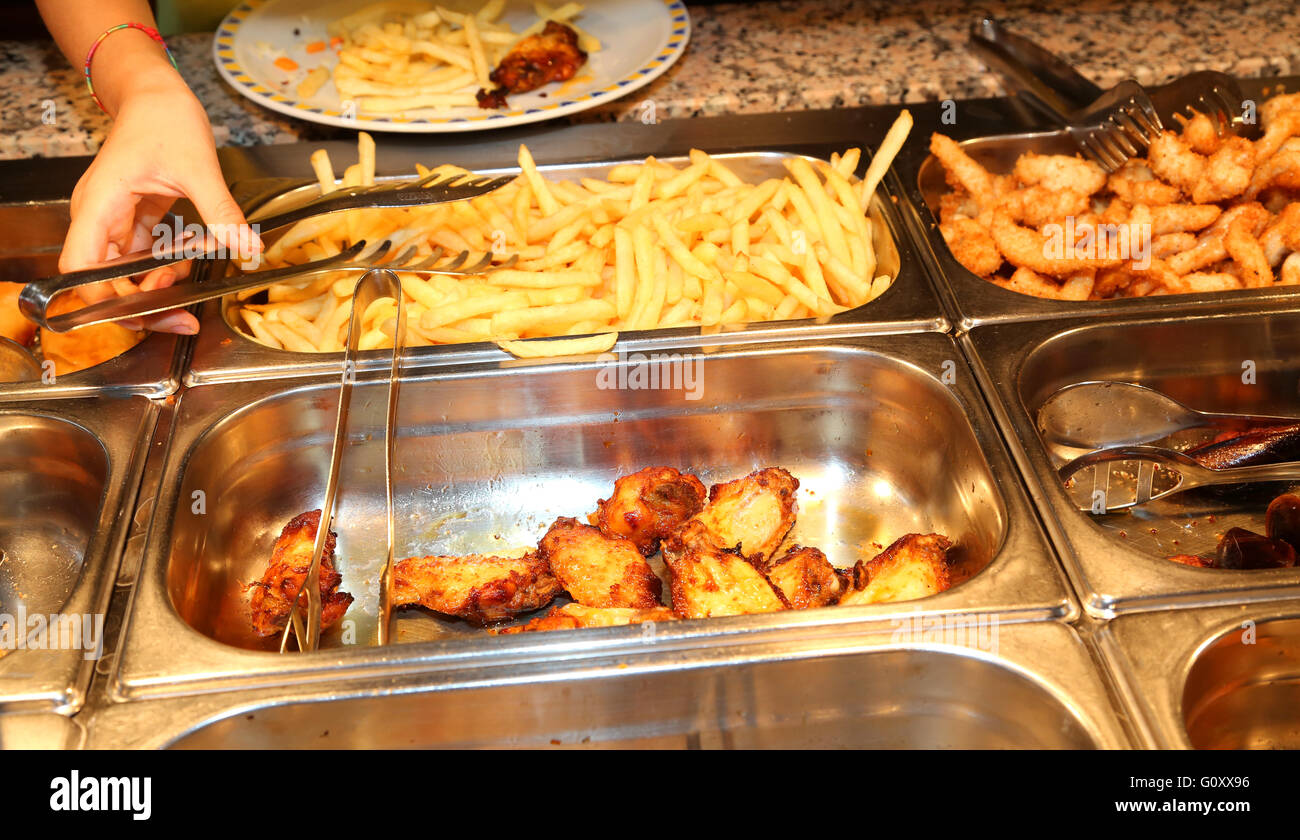 large stainless steel trays in the self-service area Stock Photo - Alamy