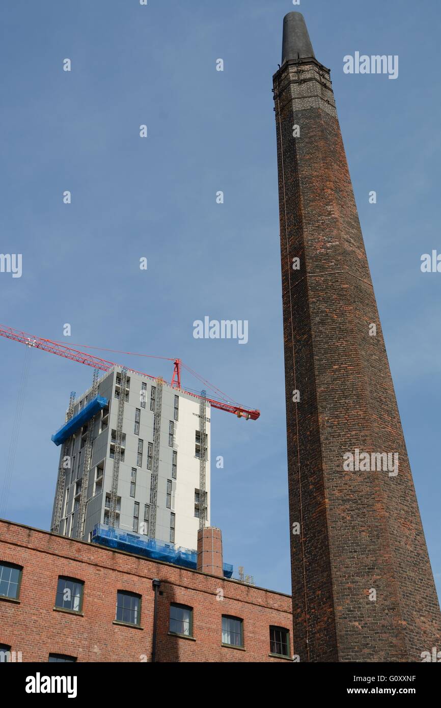 New development rises above older mill style property in Manchester ...