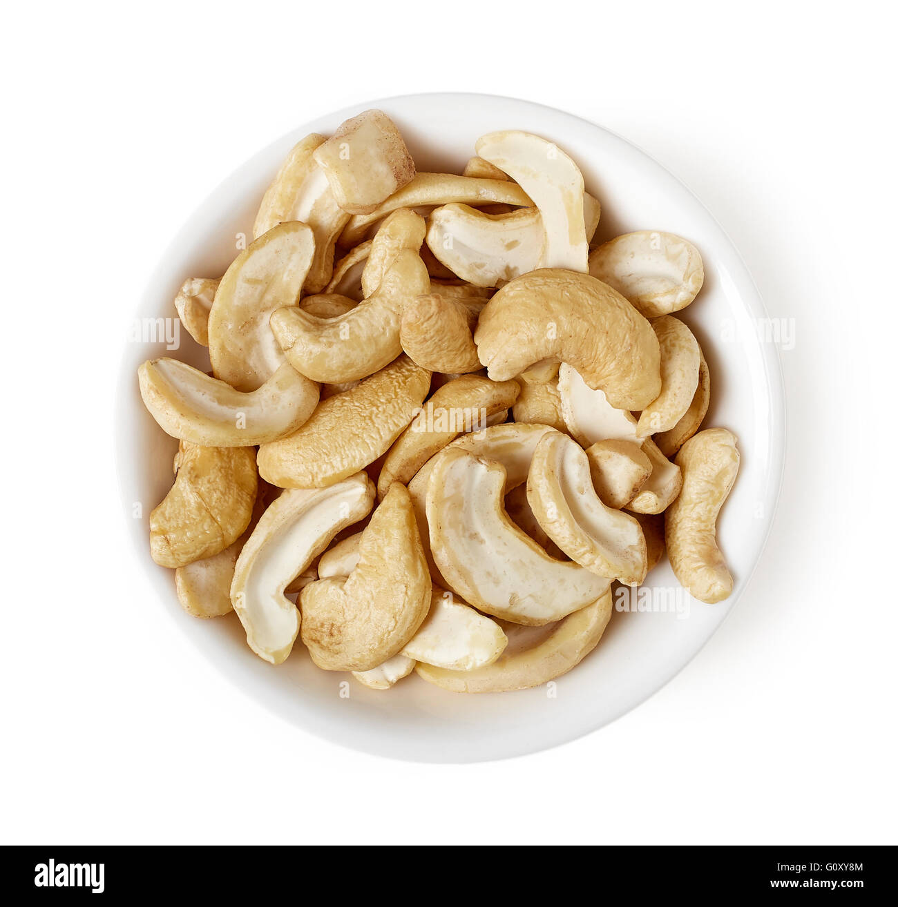 Bowl of unshelled cashew nuts isolated on white background, top view ...