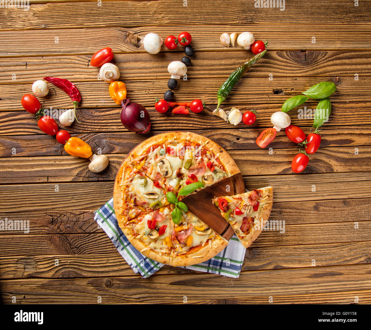 Rustic pizza with pizza text above made of fresh ingredients. Served on ...