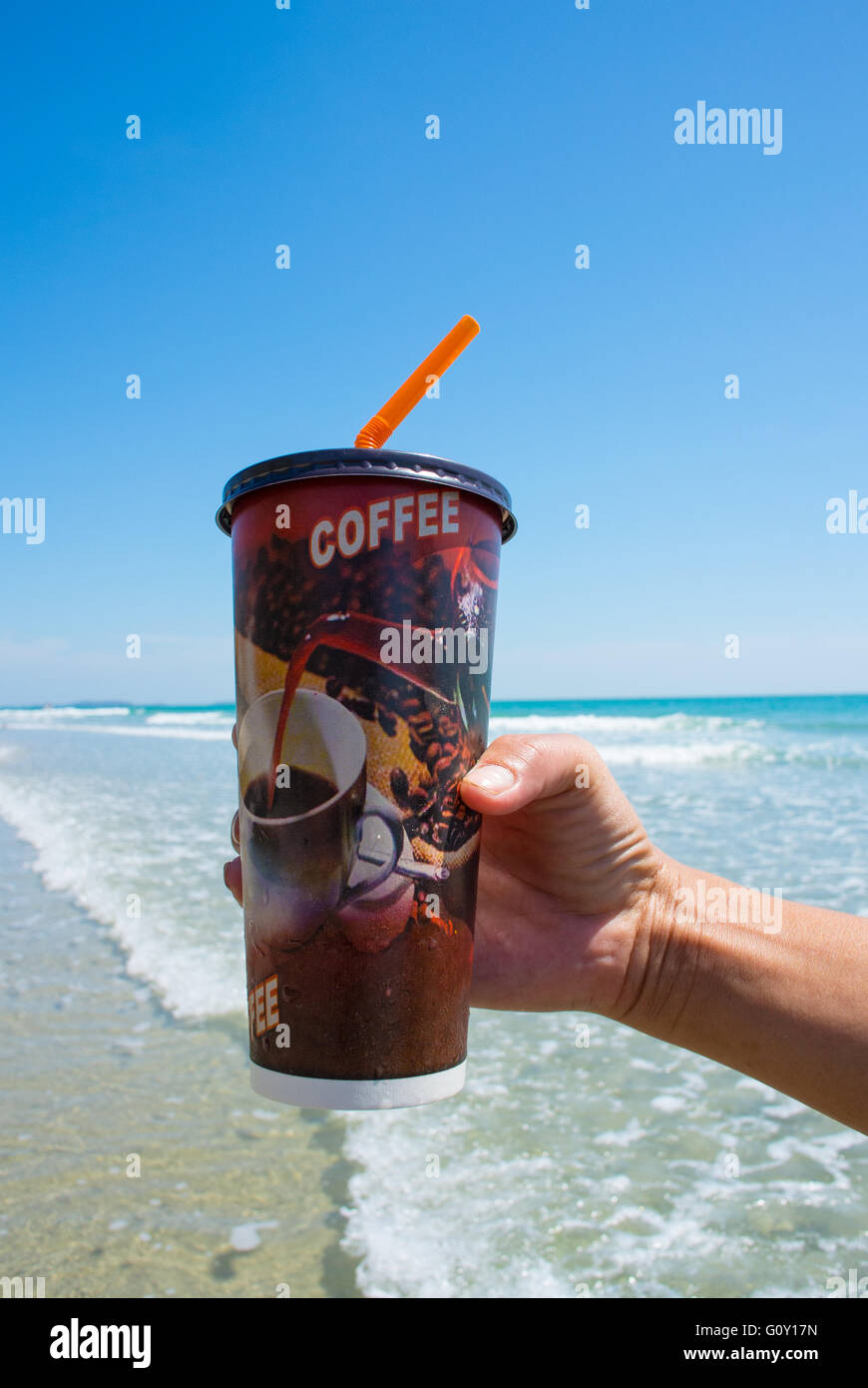 Girl drinking iced coffee at the beach in Thailand Stock Photo - Alamy