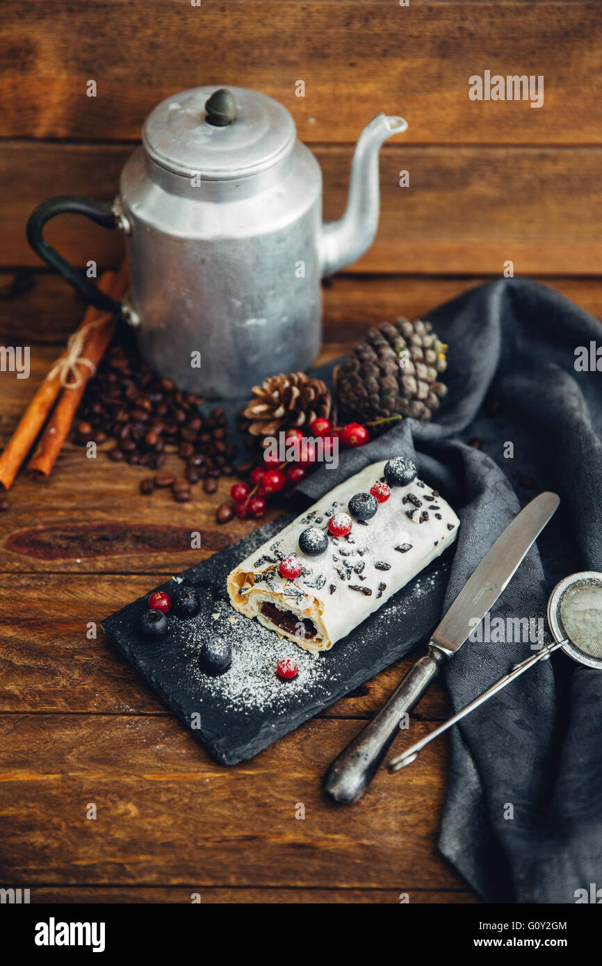 Chocolate roll with summer fruits and icing sugar Stock Photo - Alamy