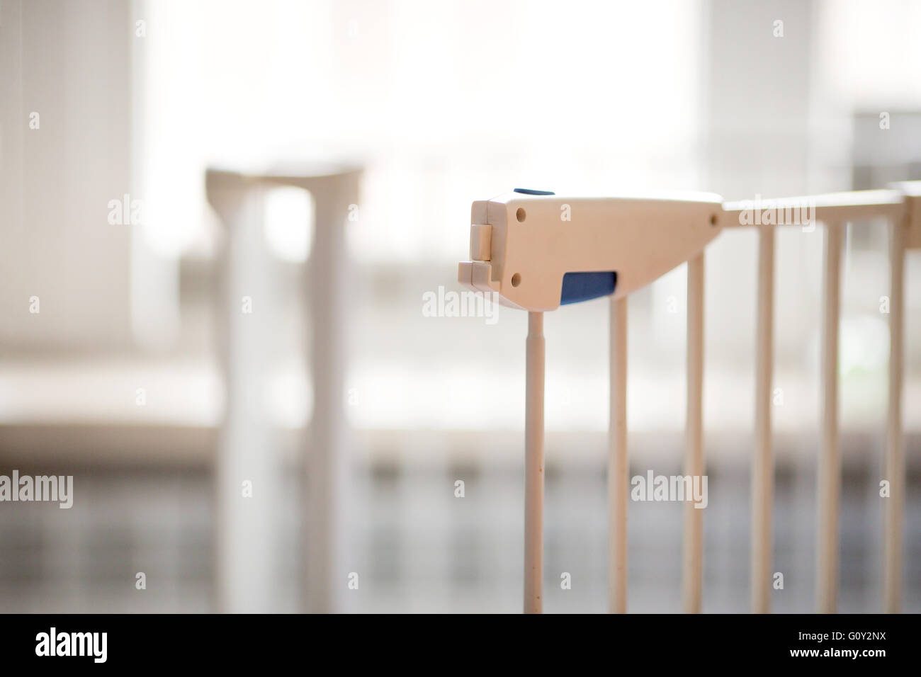 Close-up of open child gate indoors Stock Photo - Alamy