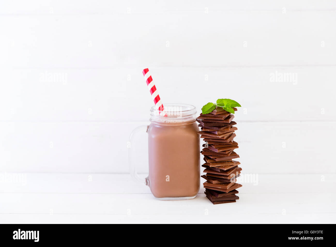 Chocolate milkshake and stack of chocolate Stock Photo - Alamy