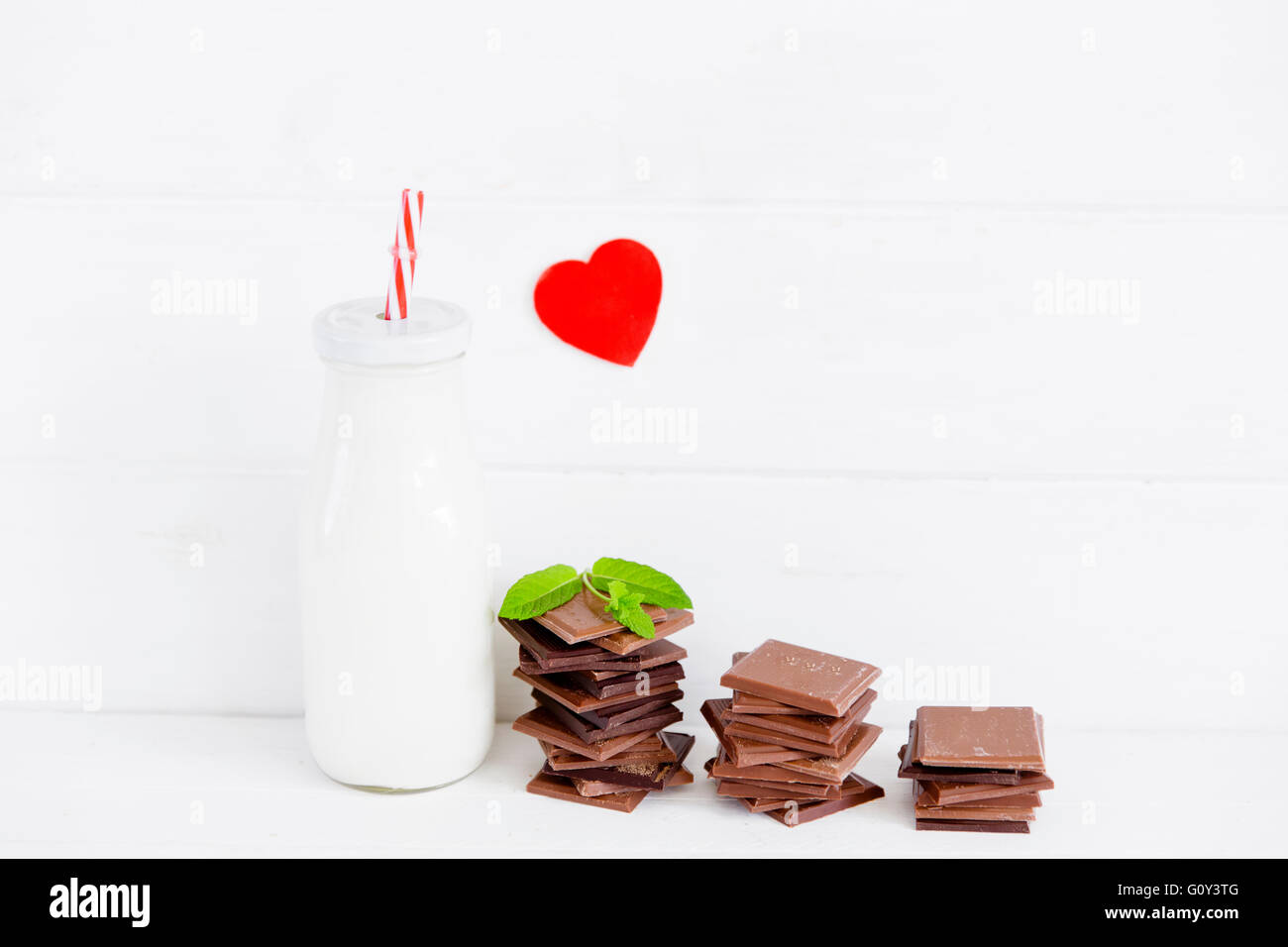 Bottle of milk with stack of chocolate Stock Photo - Alamy