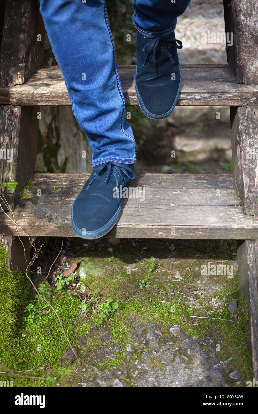 Man walking down wooden steps Stock Photo - Alamy