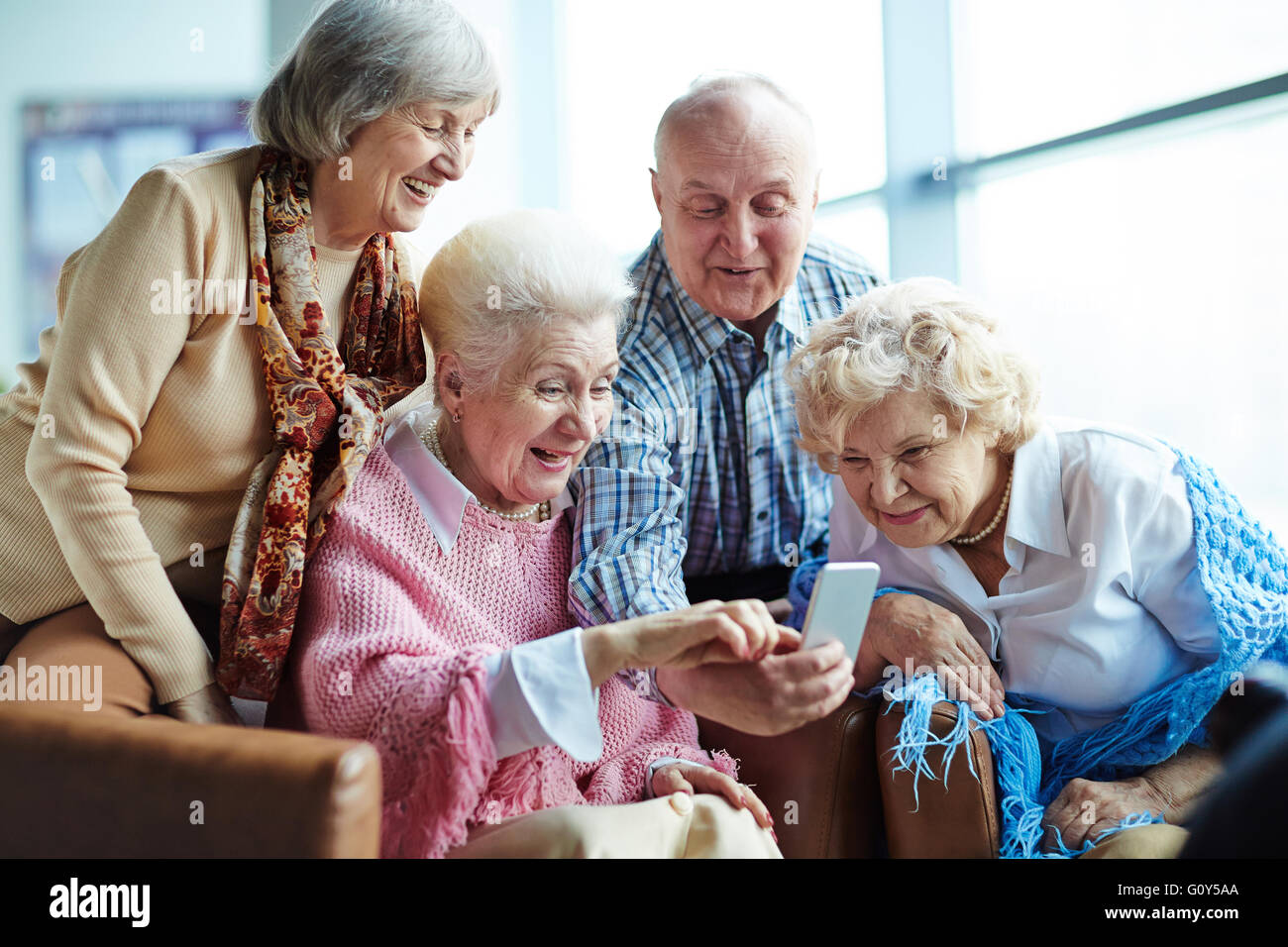Group positive seniors sitting hi-res stock photography and images - Alamy