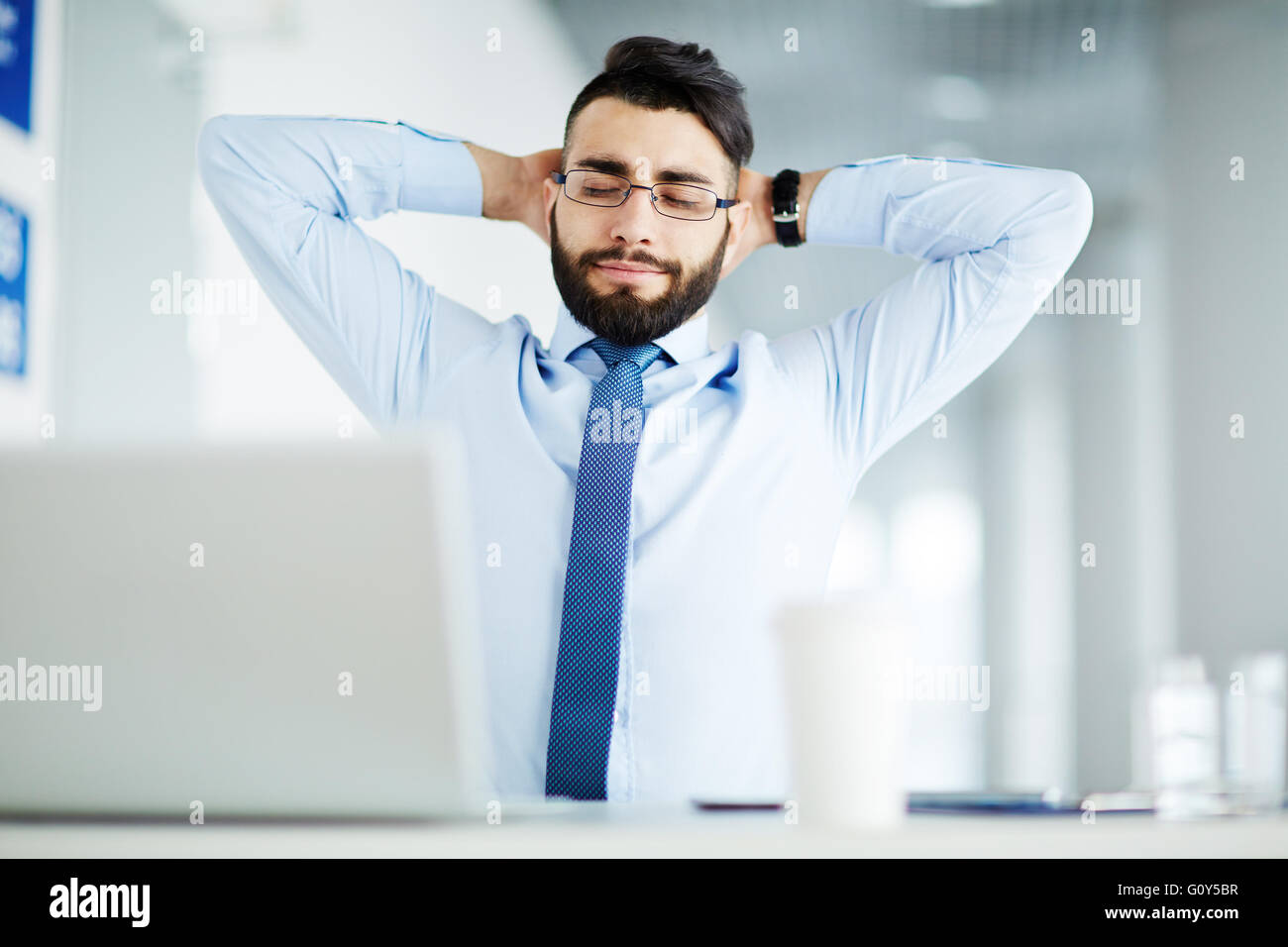 Relaxed young businessman with laptop hi-res stock photography and ...