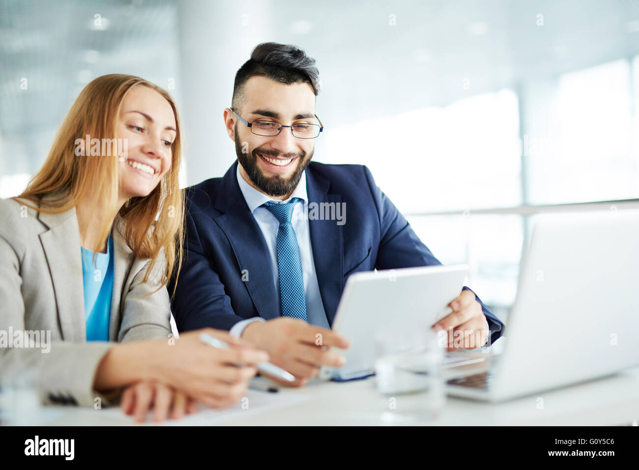 Working with colleague Stock Photo - Alamy