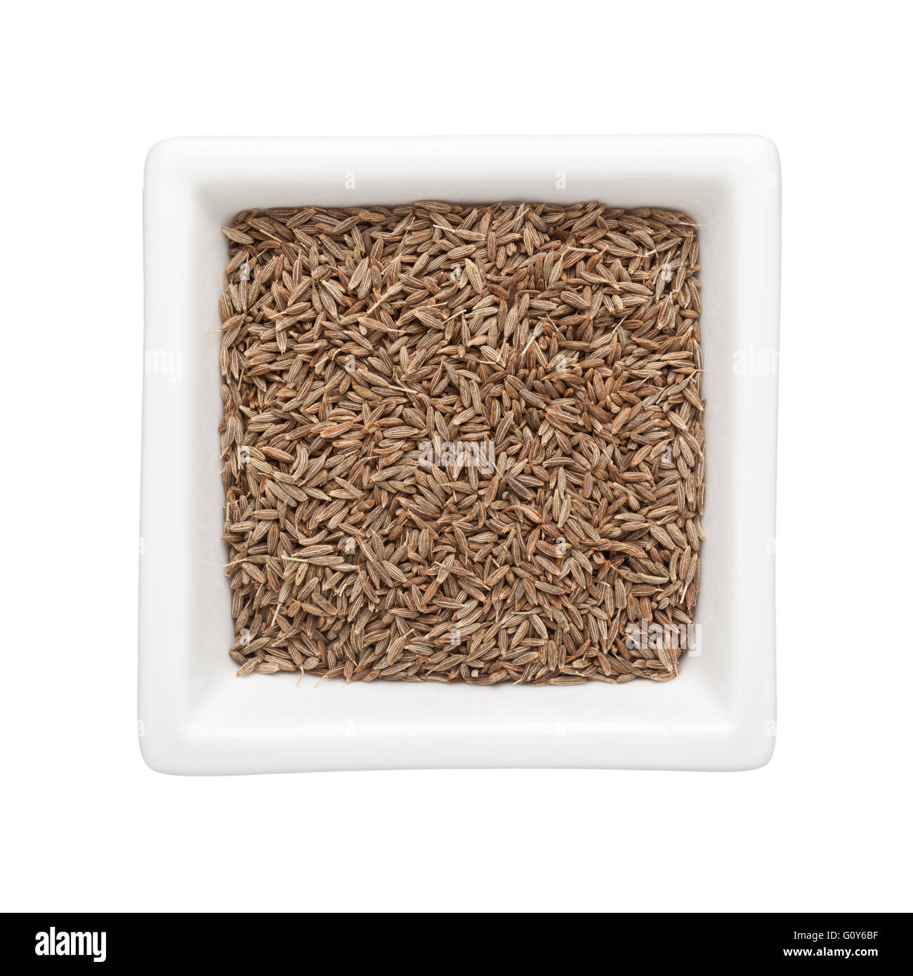 Cumin seeds in a square bowl isolated on white background Stock Photo ...