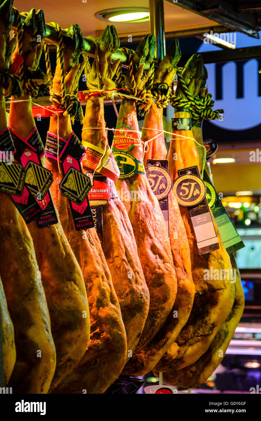 Iberico hams on a stall in Mercat de Sant Josep de la Boqueria, a ...