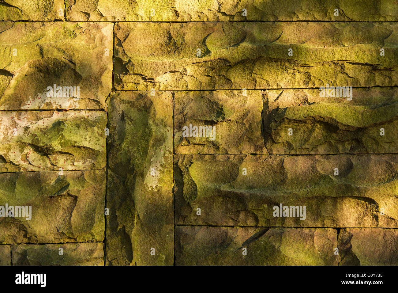 Texture of the flat stone wall with shadows closeup in evening Stock ...