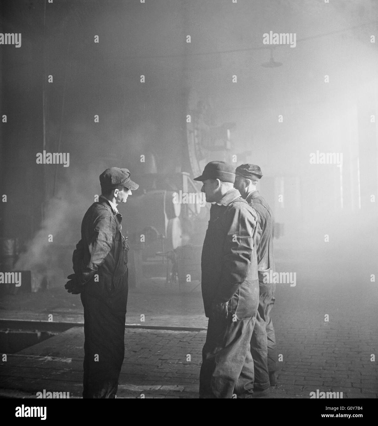Three Workers in the Roundhouse at Chicago and Northwestern Railroad ...