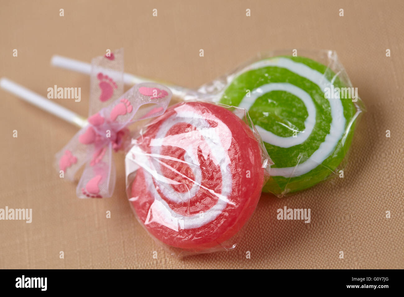candy on a stick on a beige background Stock Photo - Alamy