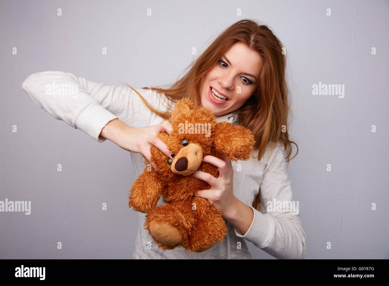 girl breaks teddy bear Stock Photo - Alamy