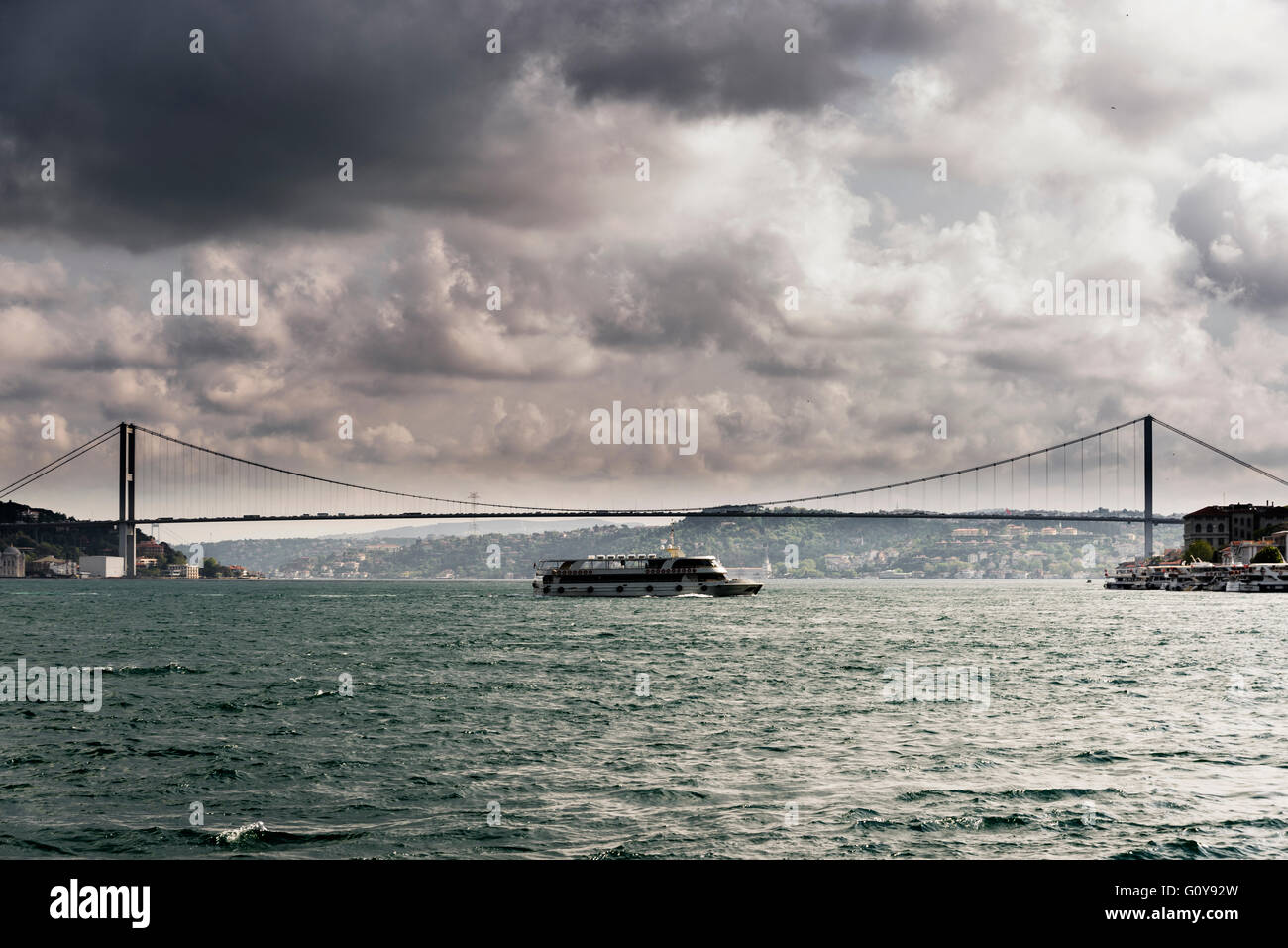 Istanbul bosphorus bridge with a public transportation ship Stock Photo ...