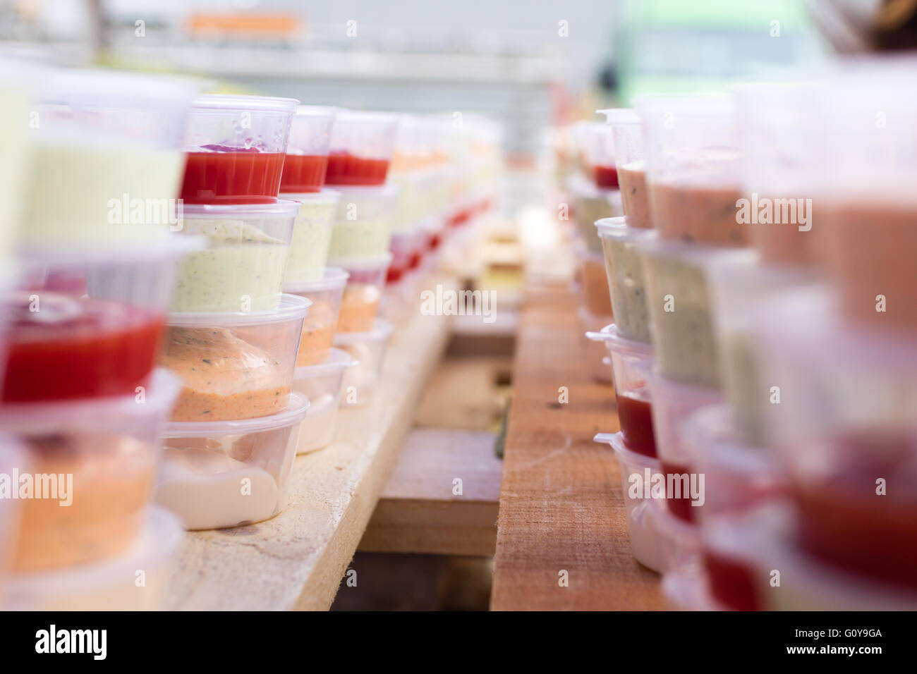 sauces in plastic containers for buffet Stock Photo - Alamy