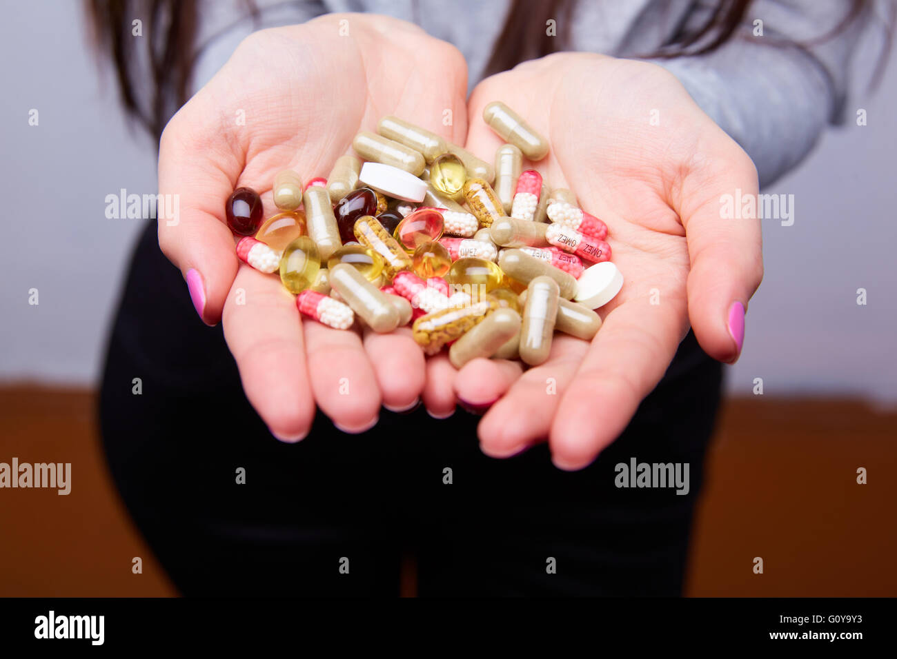 Woman taking lot pills hi-res stock photography and images - Alamy