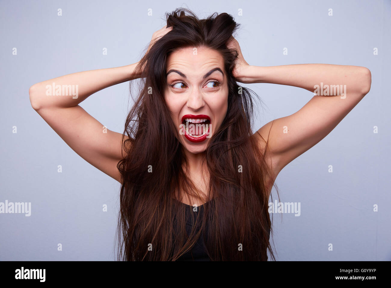 woman screaming and holding his head Stock Photo - Alamy