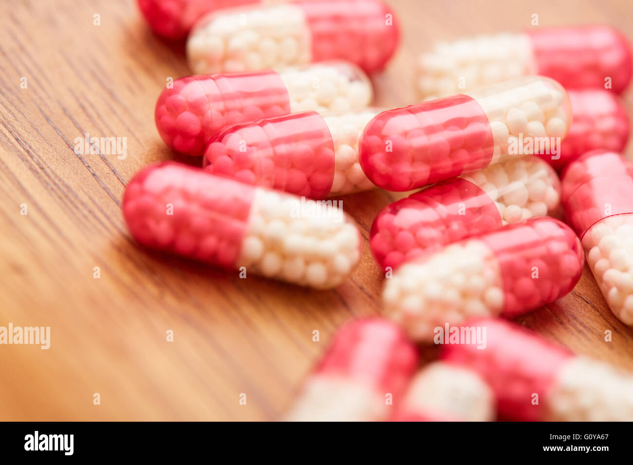pink white capsules Stock Photo - Alamy