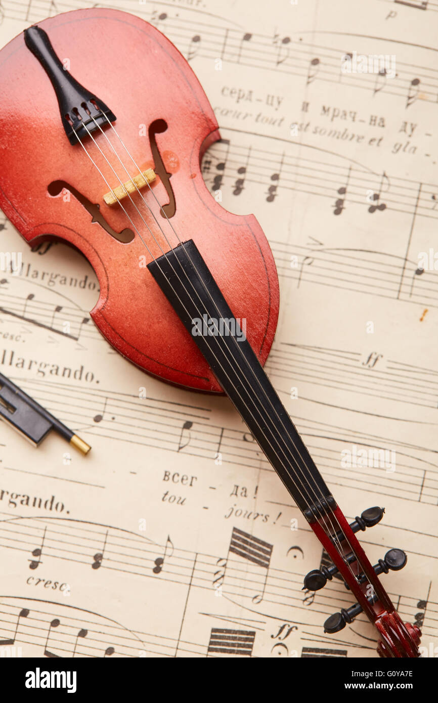 violoncello on of notes background Stock Photo - Alamy