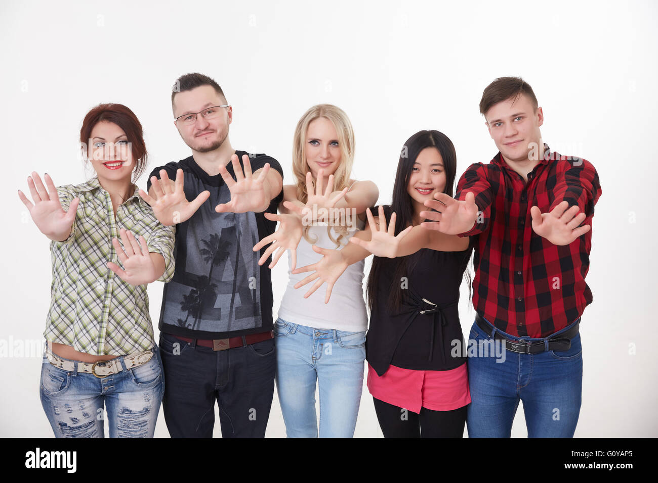 group of young people waving their hands Stock Photo - Alamy