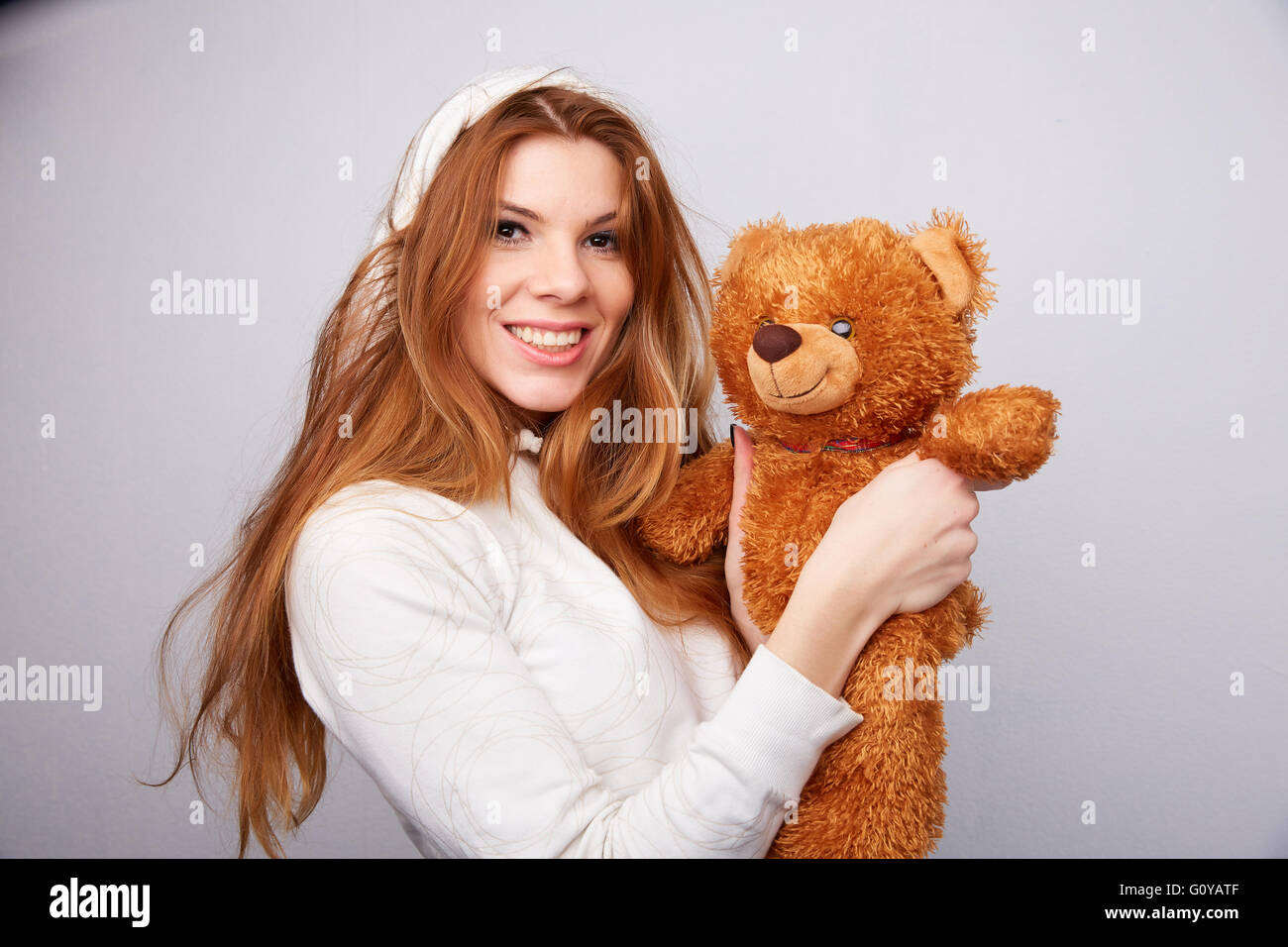 red-haired woman with a teddy bear Stock Photo - Alamy