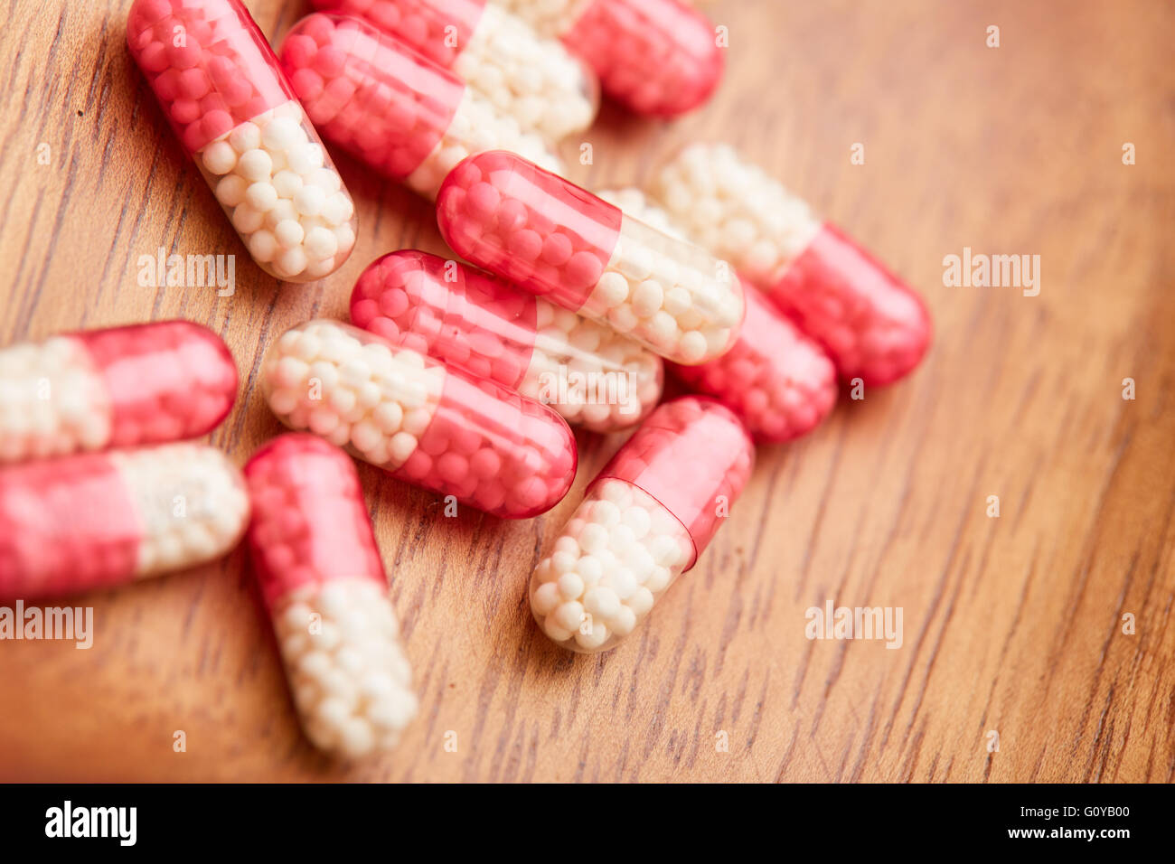 pink white capsules Stock Photo - Alamy