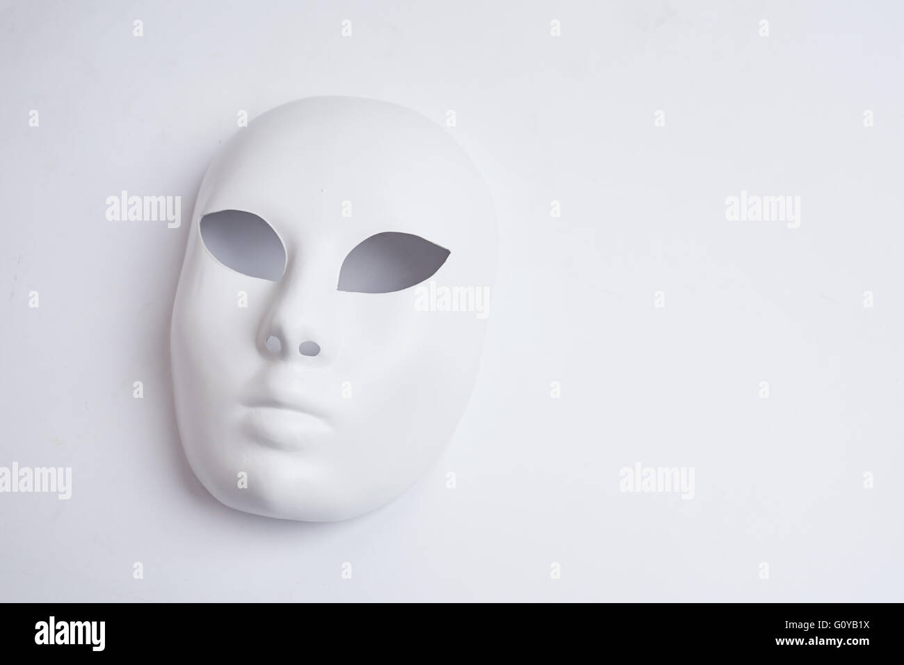 white venetian mask on a white background Stock Photo - Alamy