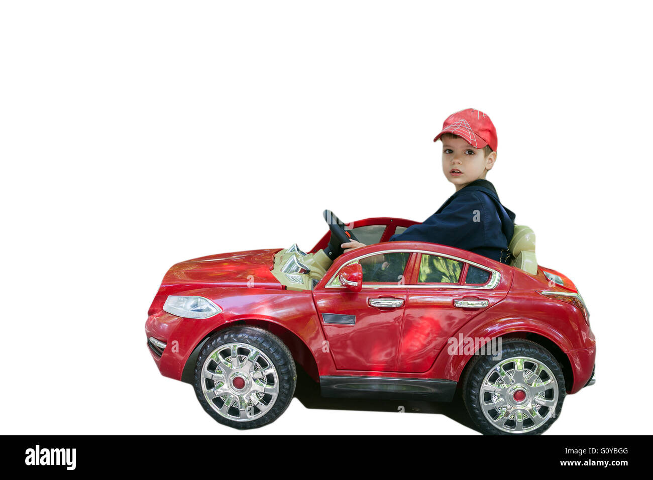boy rides a red car isolated on a white background Stock Photo - Alamy