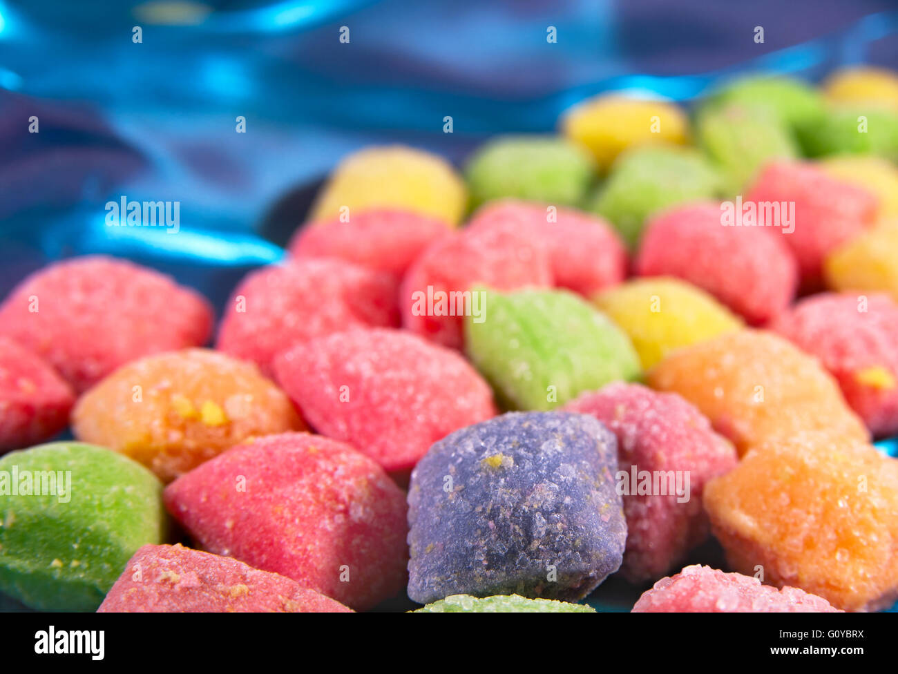 Small colorful pillows. Sweet candies Stock Photo - Alamy