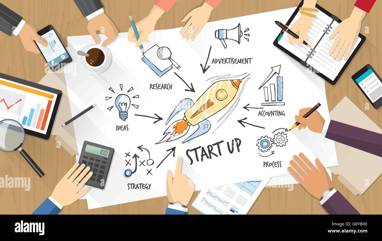 Start up concept with business people working on a desk together and ...