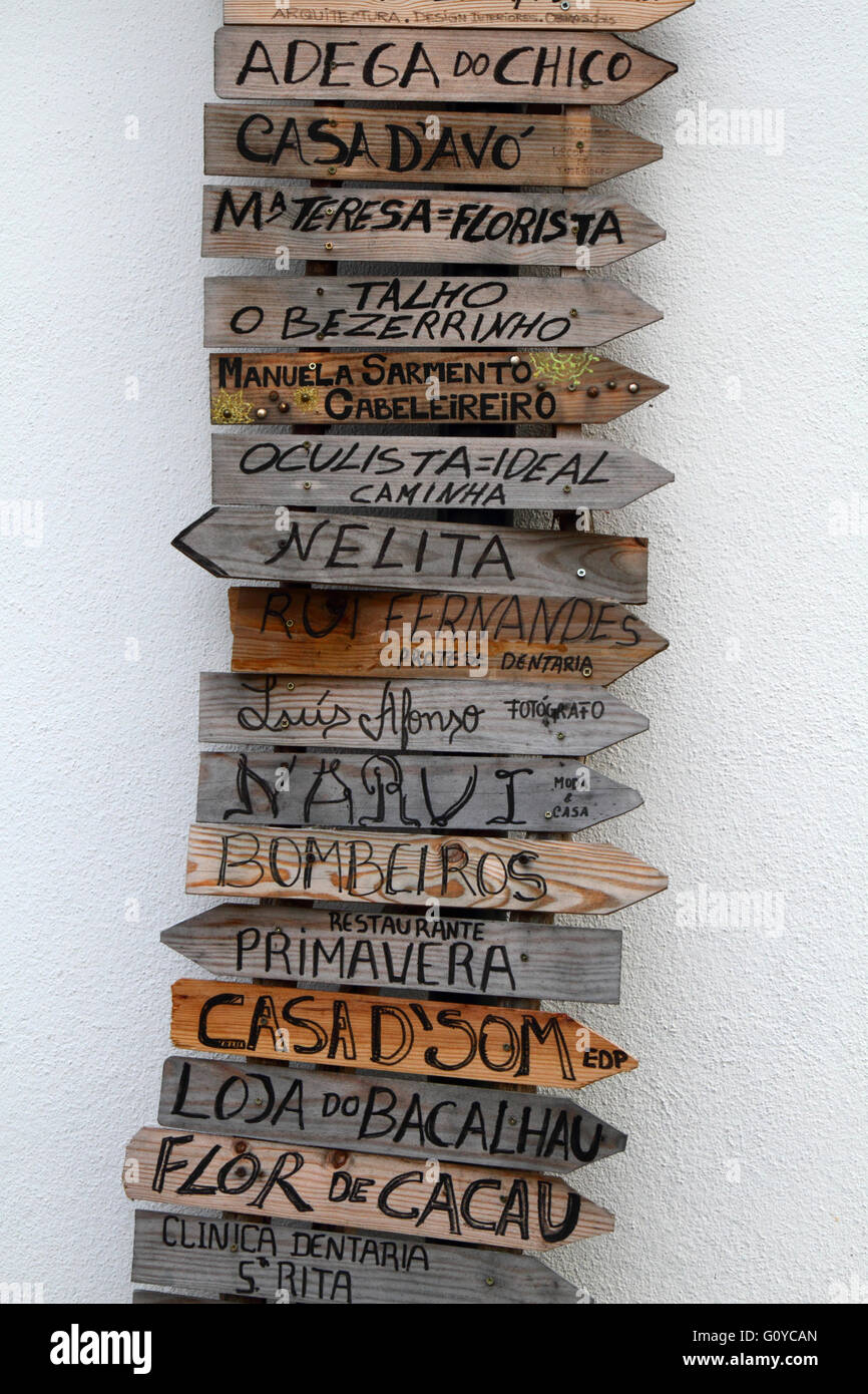 Rustic wooden signs in town centre giving directions to local ...