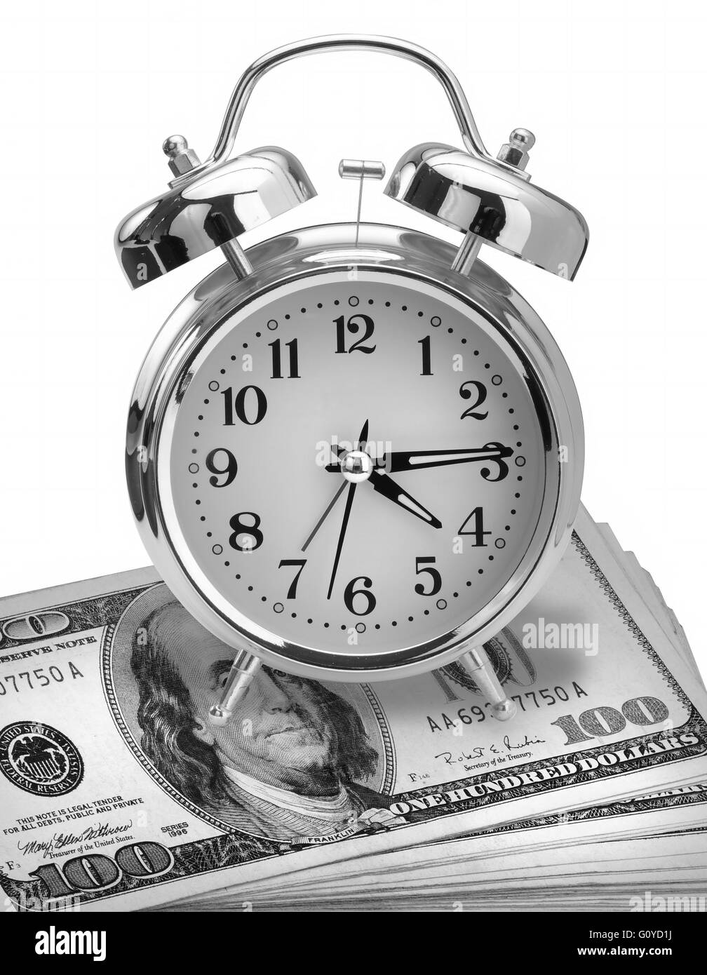 Time and Alarm clock on top of cash in black and white Stock Photo - Alamy