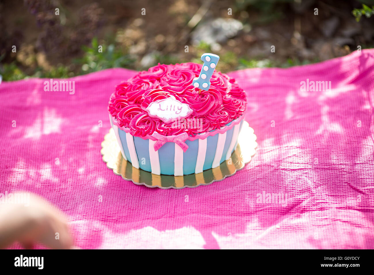 cake smash pink cake with blue and white stripes Stock Photo - Alamy