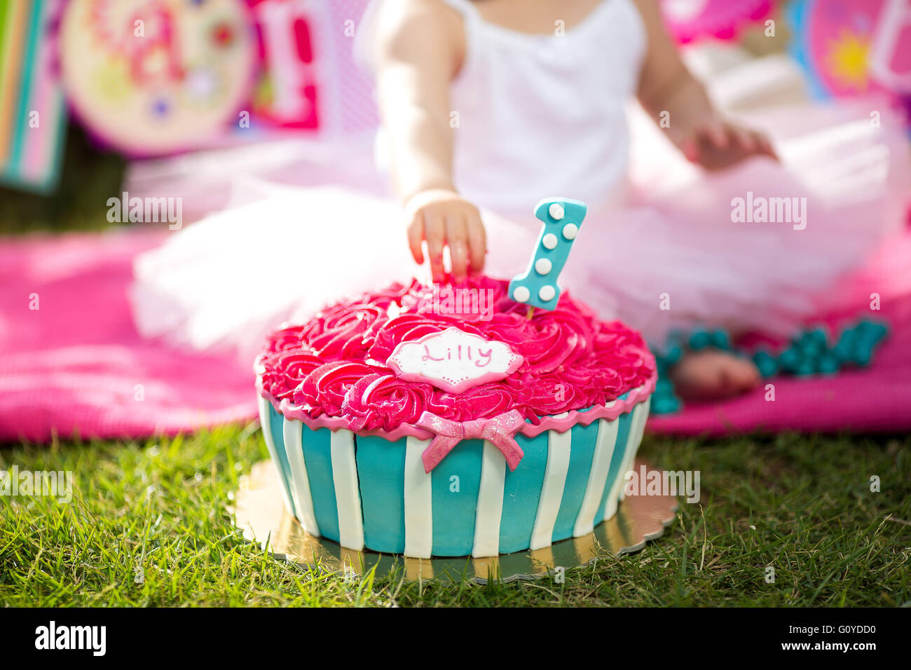 cake smash pink cake with blue and white stripes Stock Photo - Alamy