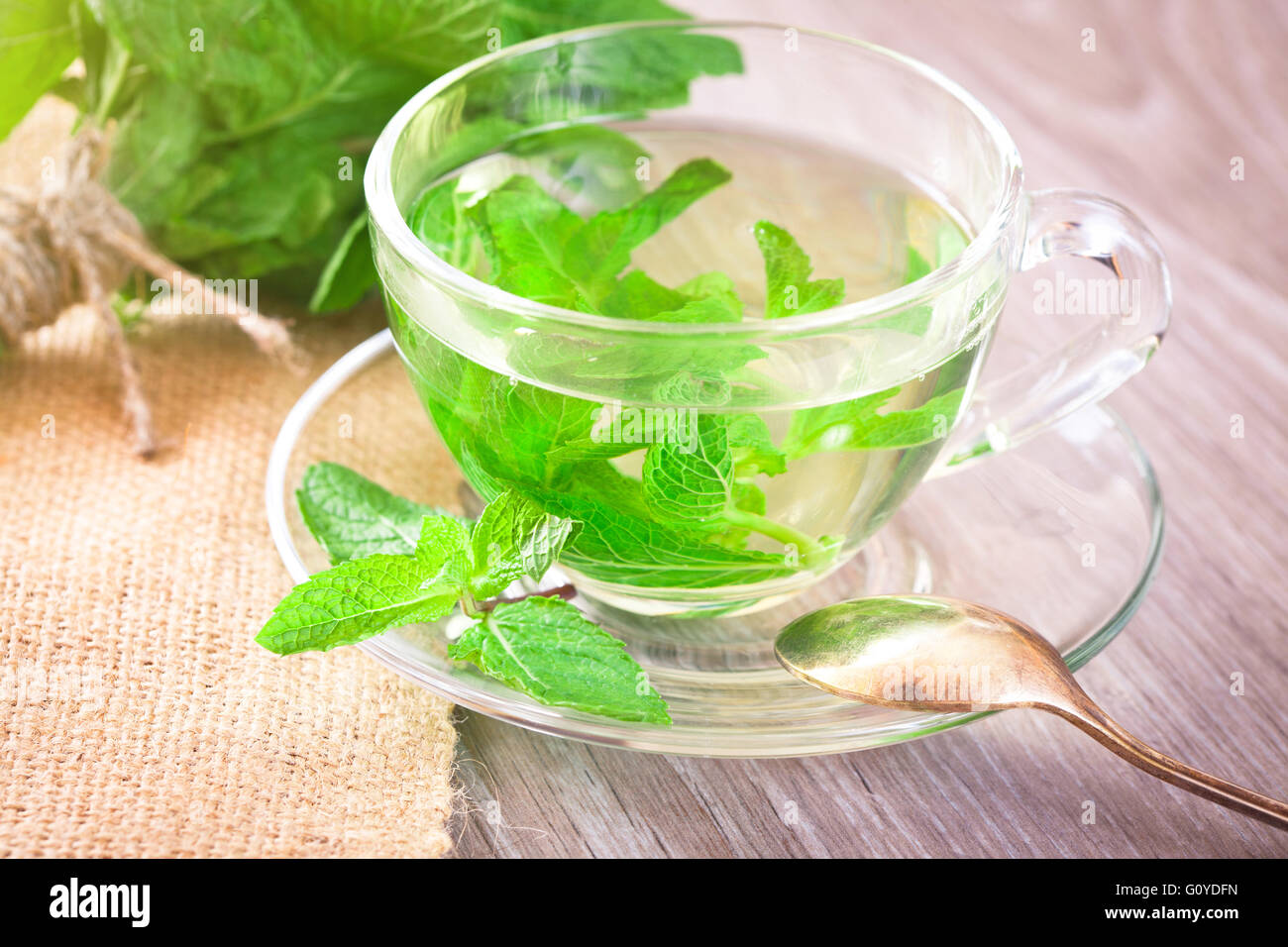 Mint tea in a transparent glass cup on the table Stock Photo - Alamy