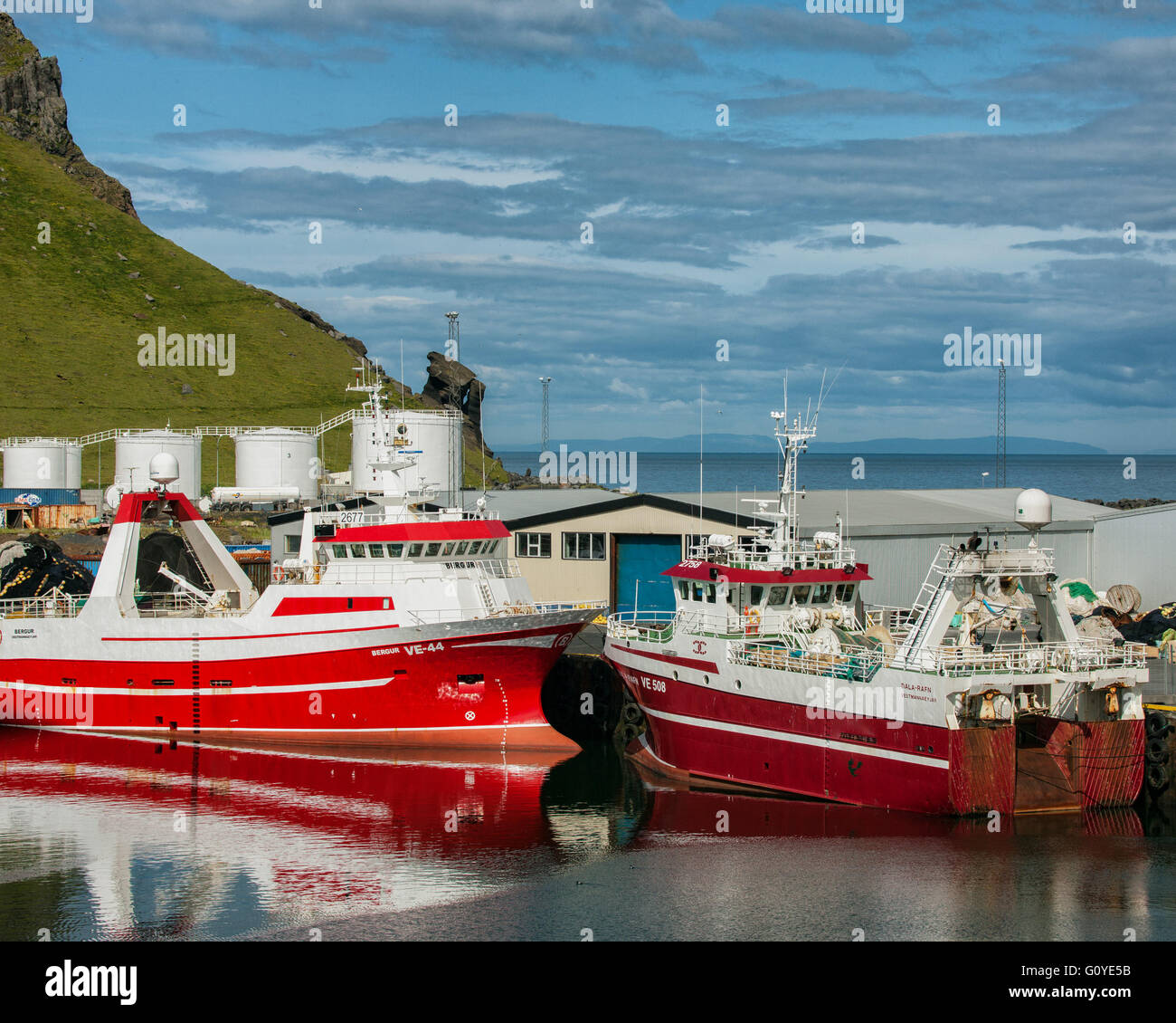August 3, 2015 - Fishing trawlers in Heimaey harbor beneath the ...